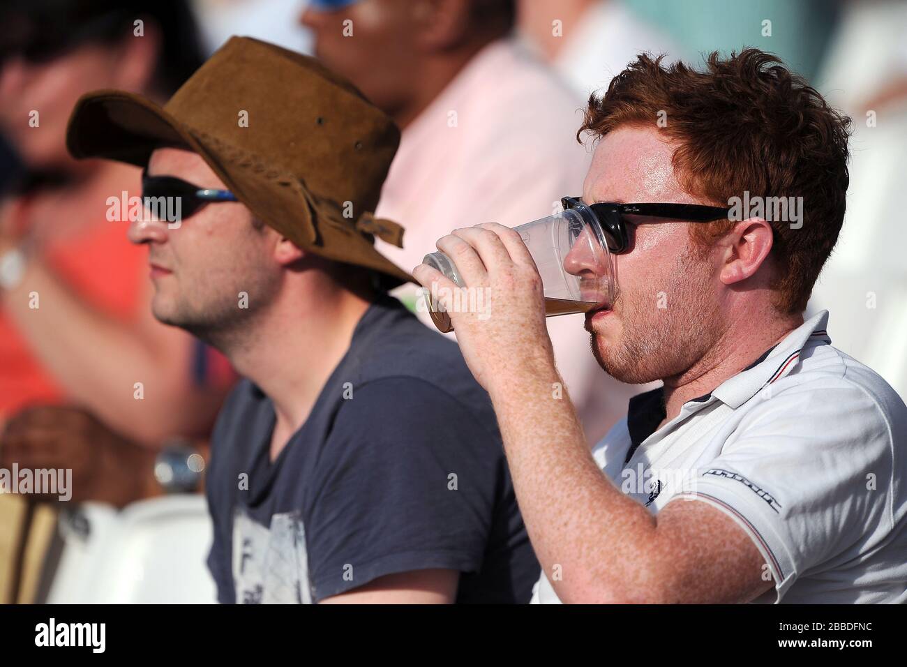 The crowd enjoy the action from the stands Stock Photo - Alamy