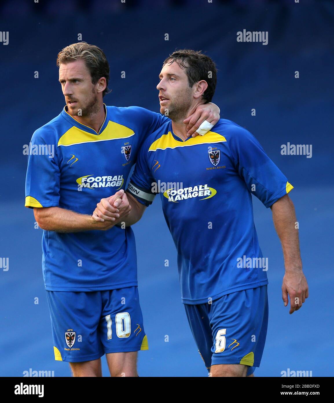 AFC Wimbledon's Alan Bennett (right) is congratulated on scoring by ...