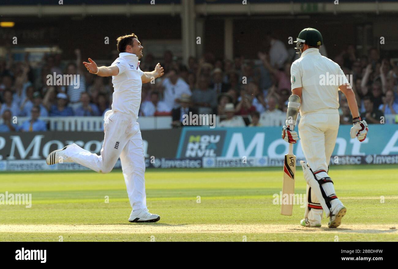England's James Anderson (left) celebrates taking the wicket of ...