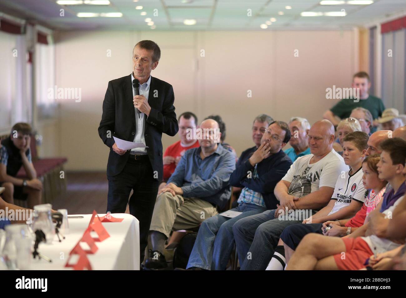 Compere Tom Watt speaks during a fans forum Stock Photo - Alamy