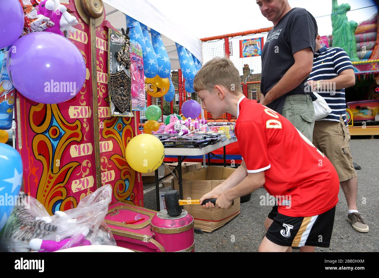 Children enjoy games stalls outside The Valley Stock Photo - Alamy