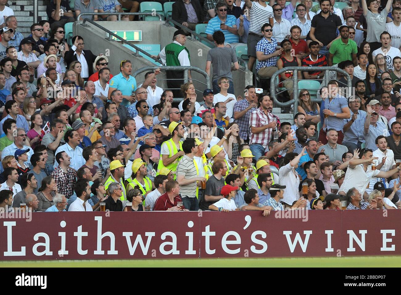 The crowd enjoy the action from the stands at the Kia Oval Stock Photo ...