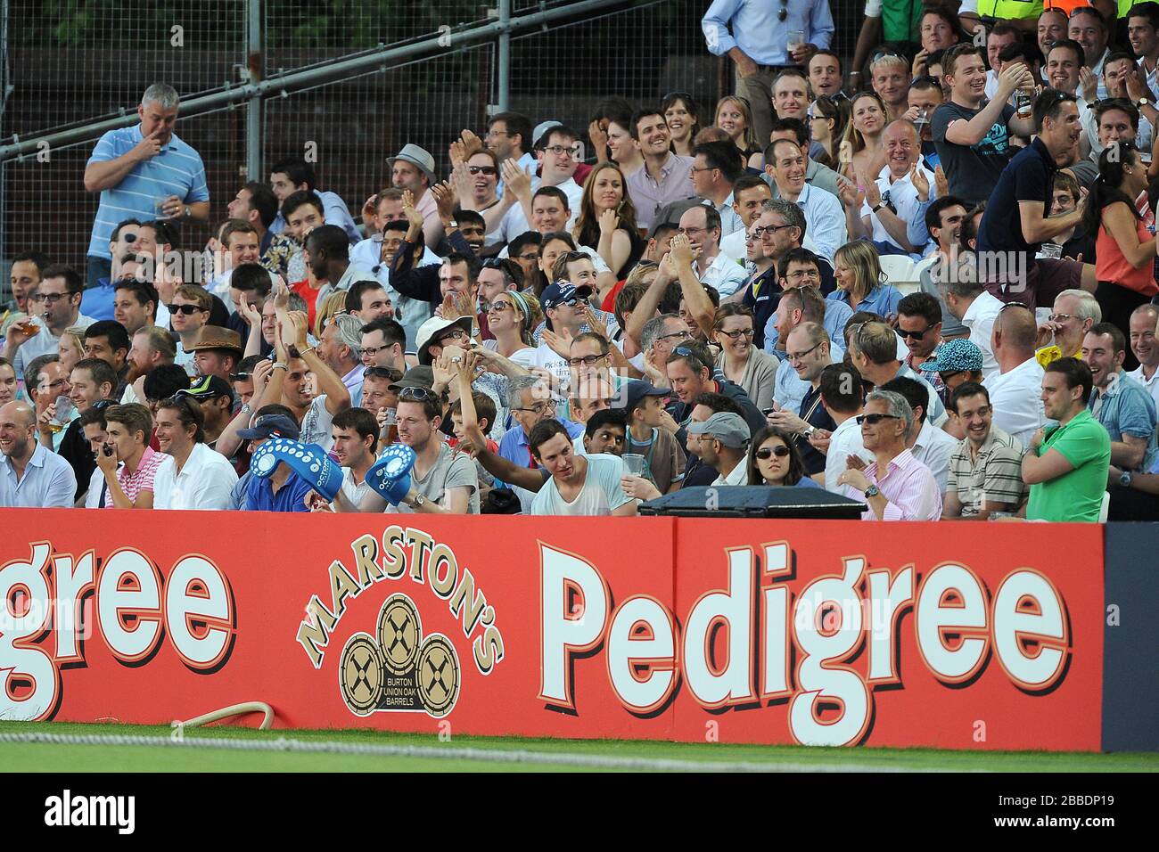 The crowd enjoy the action from the stands at the Kia Oval Stock Photo ...