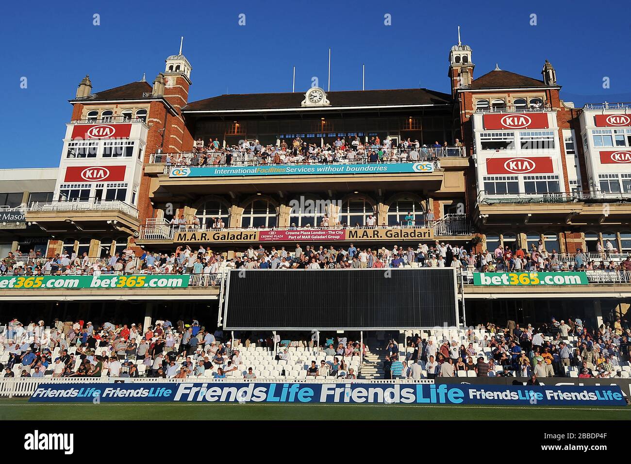 The crowd enjoy the action from the stands at the Kia Oval Stock Photo ...