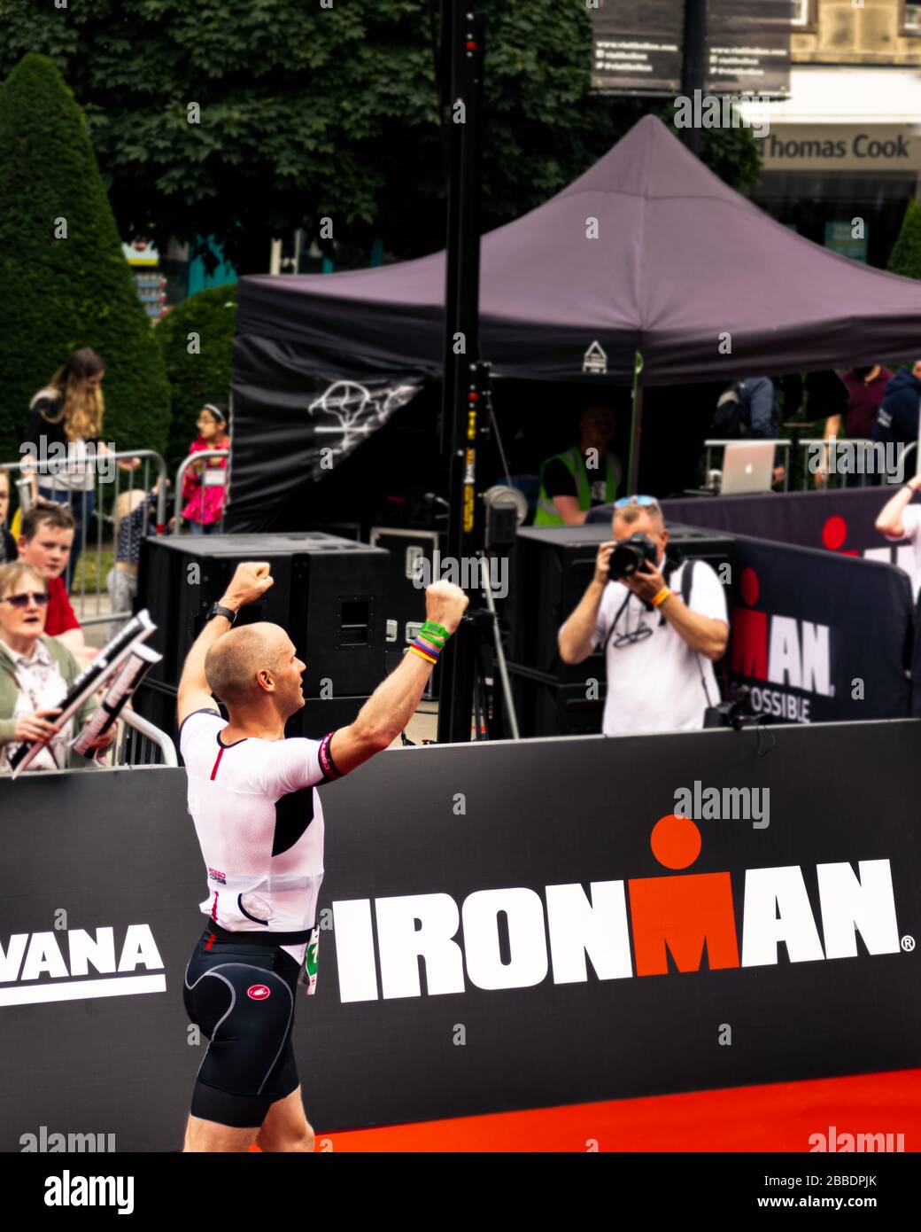 An Ironman finishers crossing the lines with arms in the air Stock ...