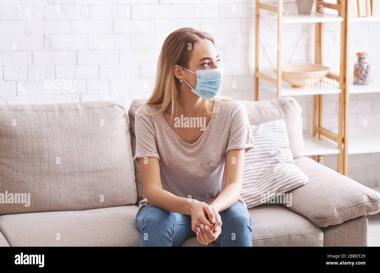 Girl in mask stayed at home during coronavirus quarantine Stock Photo ...