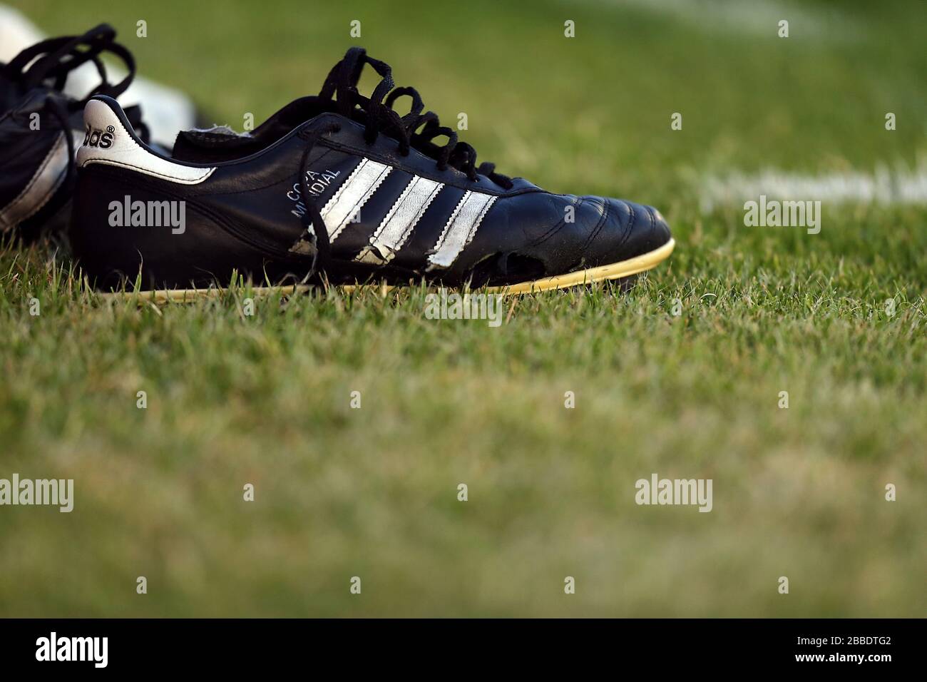 Detail of Football boots in the grass Stock Photo - Alamy