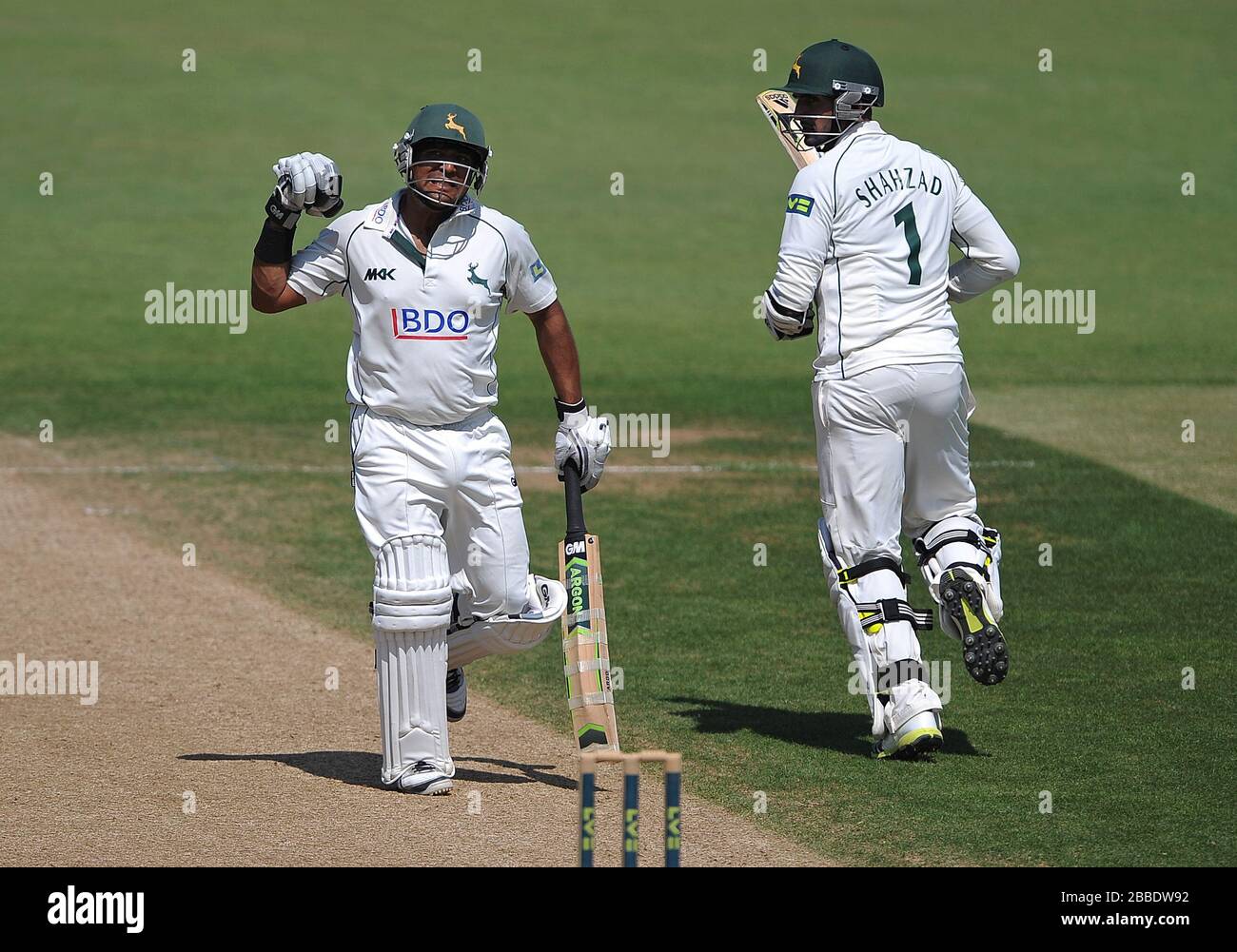 Nottinghamshire's Samit Patel (left) celebrates after reaching his ...