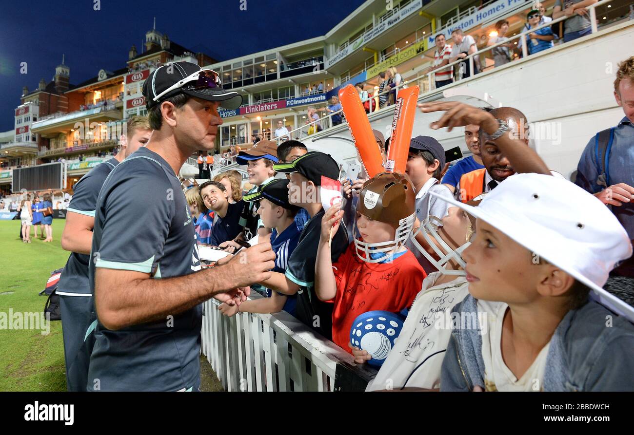 Surrey's Ricky Ponting signs autographs for fans after the game Stock ...