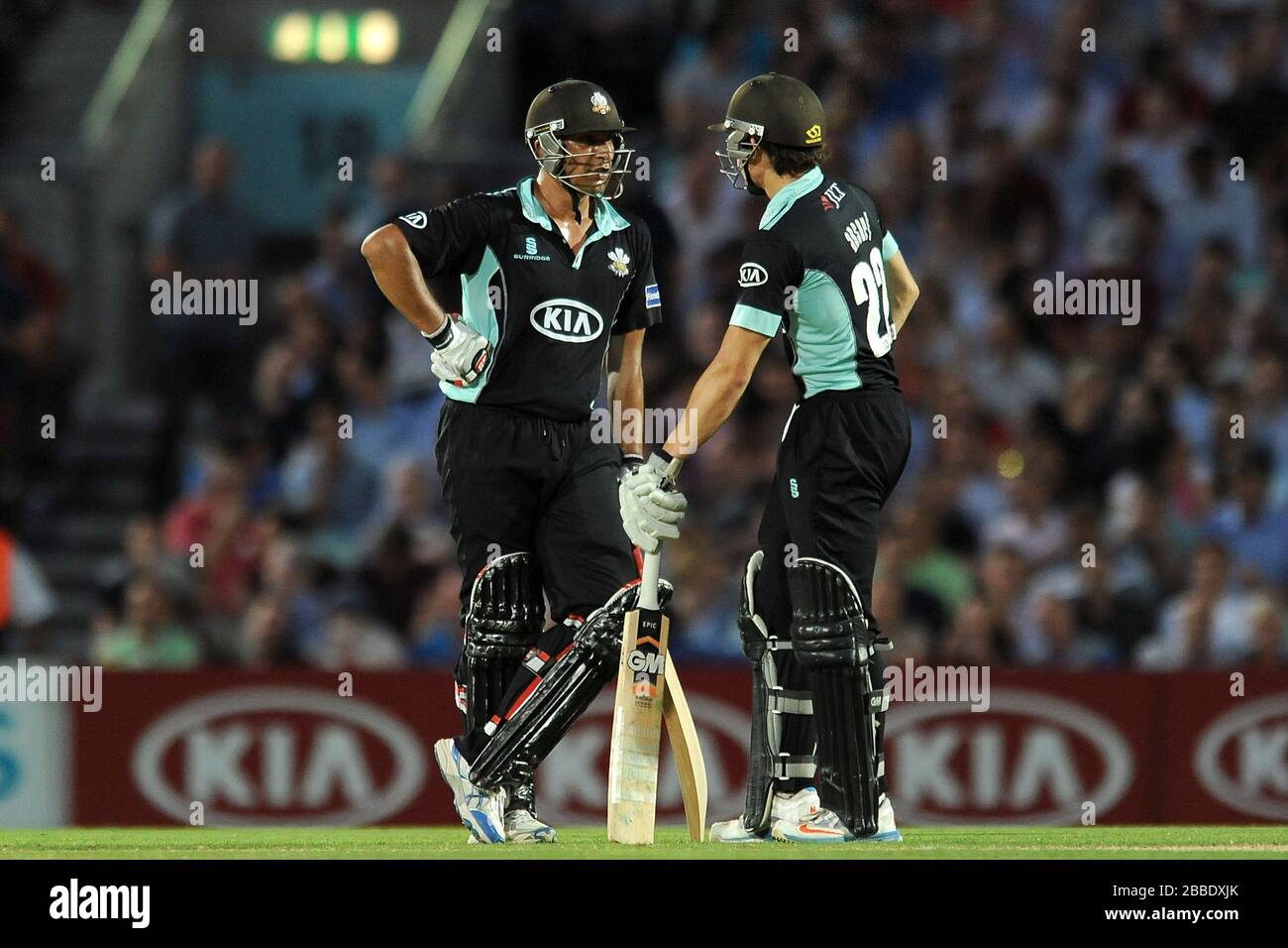Surrey's Azhar Mahood (left) speaks with teammate Zafar Ansari Stock ...