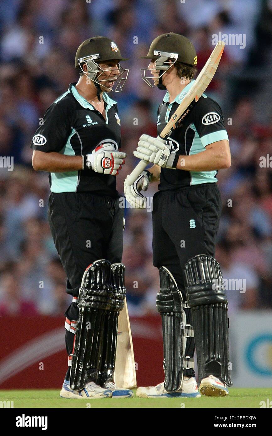 Surrey's Azhar Mahmood (left) speaks with teammate Zafar Ansari Stock ...