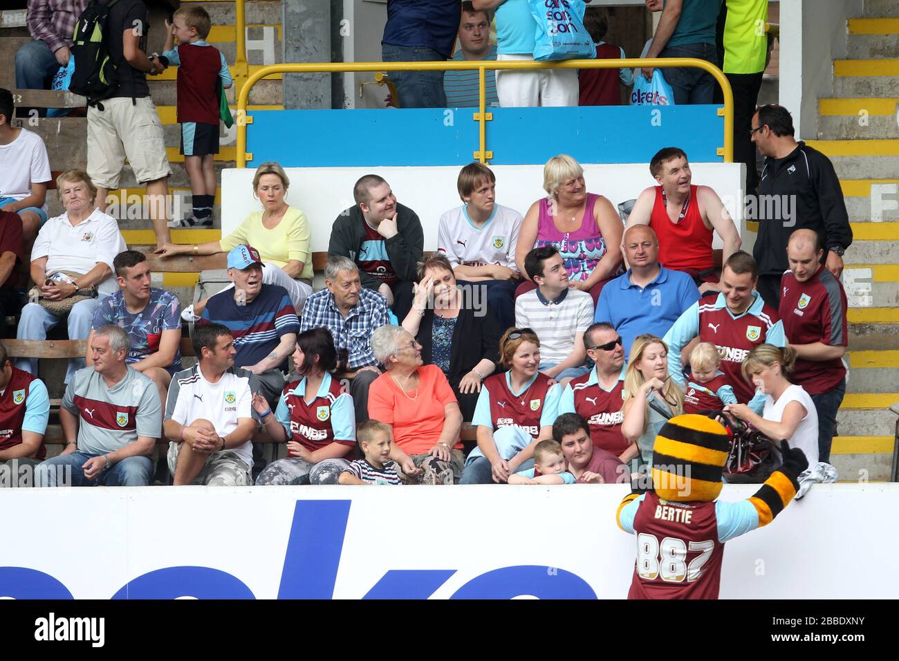 Burnley mascot Bertie Bee greets fans in the stands Stock Photo - Alamy