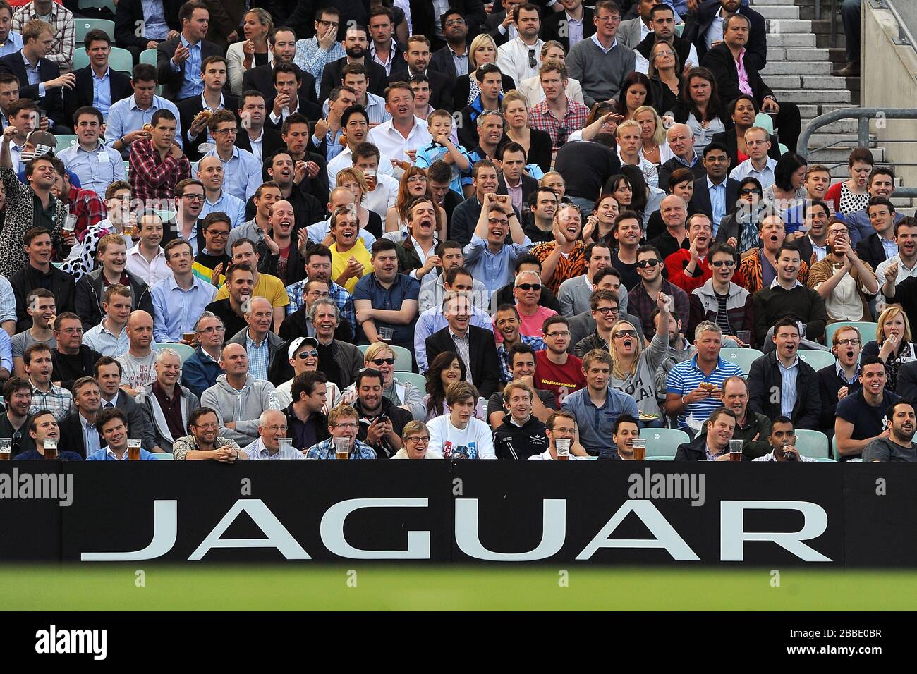 The crowd enjoy the action in the stands Stock Photo - Alamy