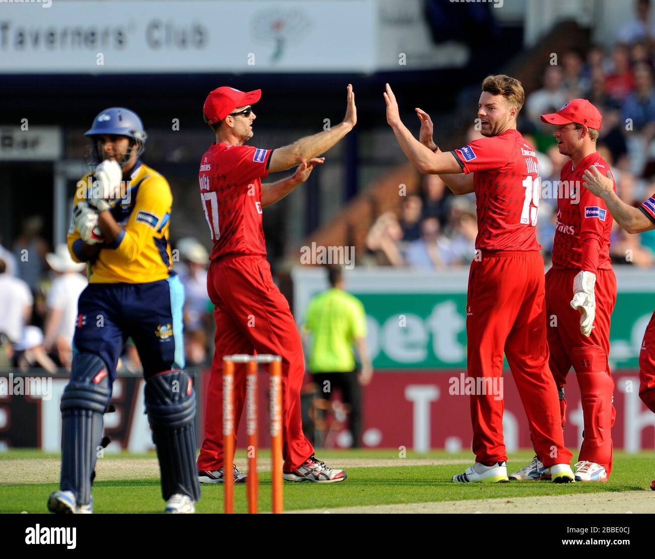 Lancashire Lightning's Arron Lilley (R) celebrates after he takes the ...