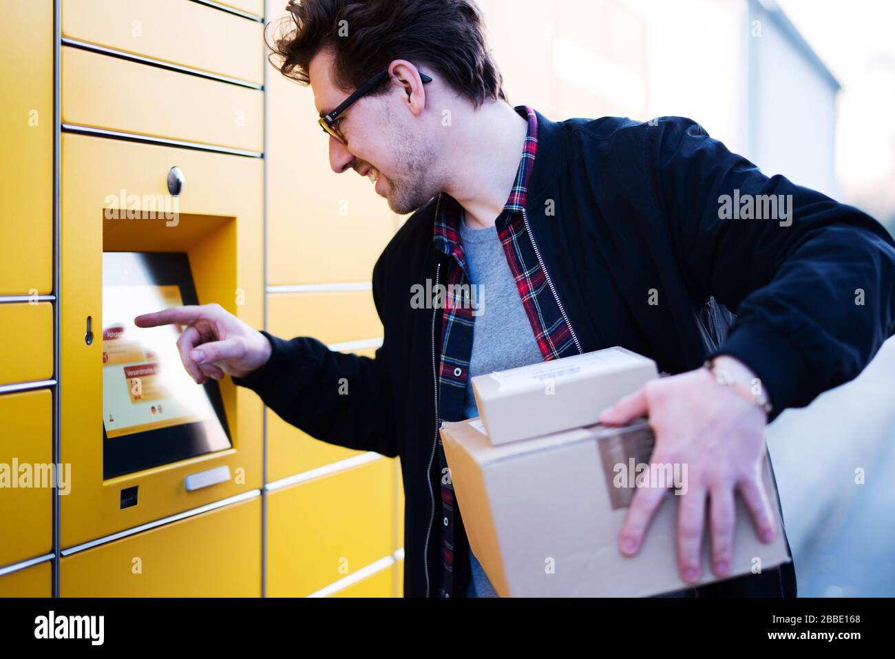 Man brings packages packing hi-res stock photography and images - Alamy