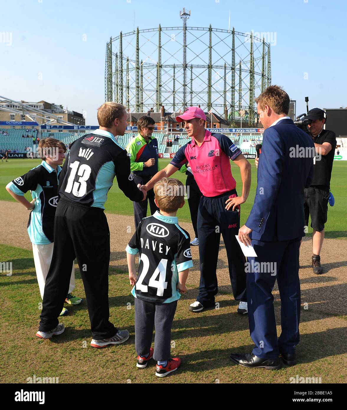 Surrey's Gareth Batty (left) shakes hands with Middlesex captain Neil ...