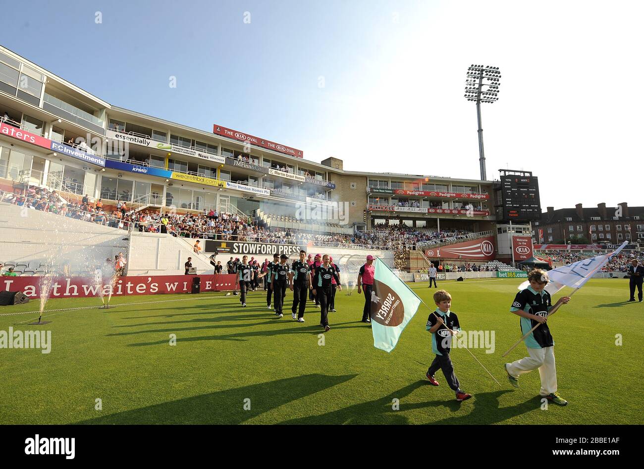 Surrey mascots lead out the players holding flags at the Kia Oval ...