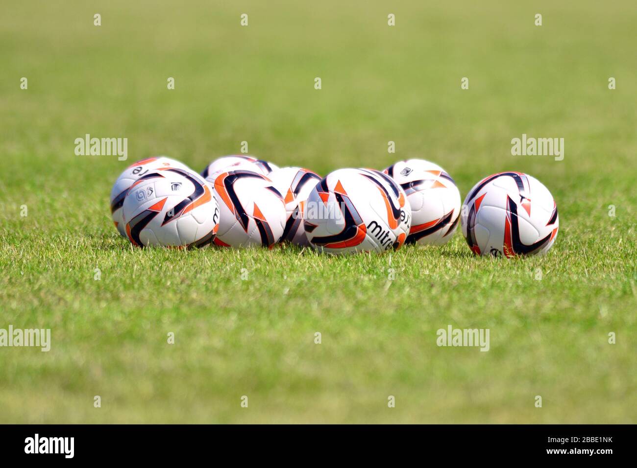 Match day balls on the pitch Stock Photo - Alamy