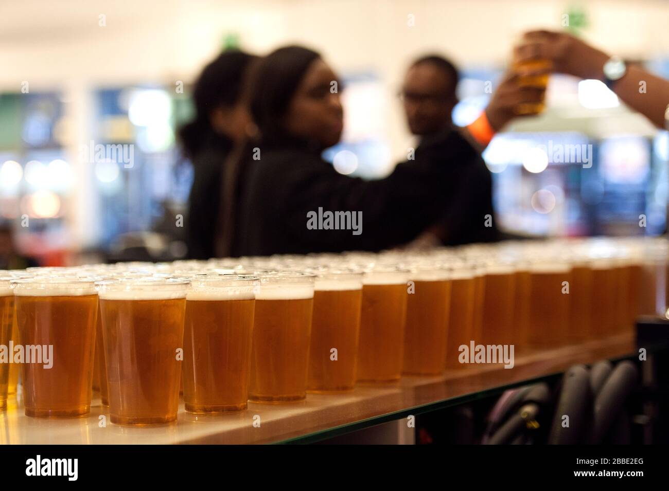 Pints of Lager are lined up waiting to be served to fans Stock Photo ...