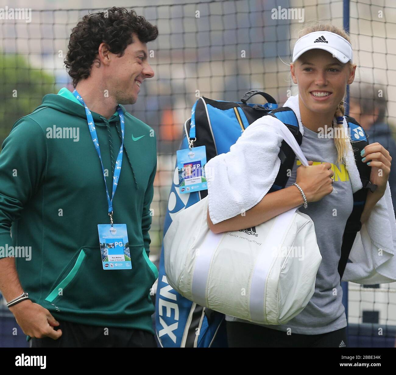 Golfer Rory McIlroy walks off the practice courts with girlfriend ...