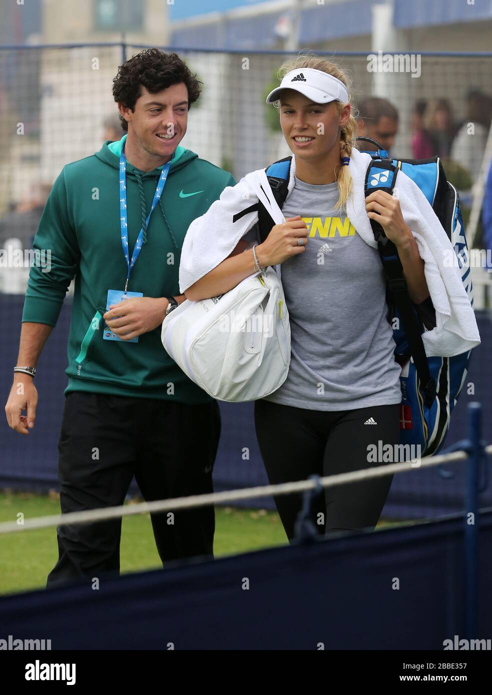 Golfer Rory McIlroy walks off the practice courts with girlfriend ...