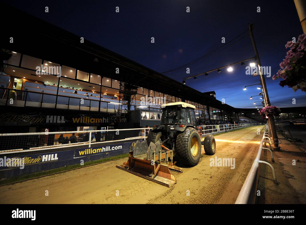 The track is raked over by a tractor after the evenings racing at ...