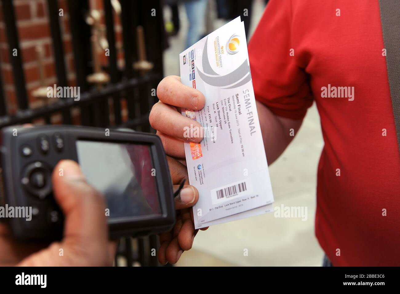 Stewards scan tickets as fans enter the Kia Oval Stock Photo - Alamy
