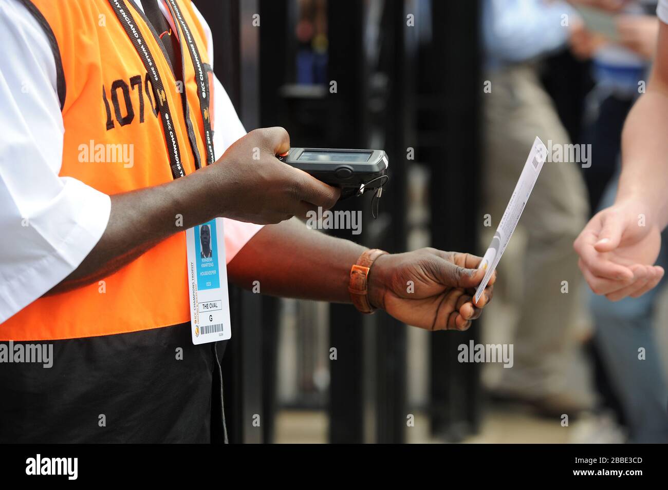 Stewards scan tickets as fans enter the Kia Oval Stock Photo - Alamy