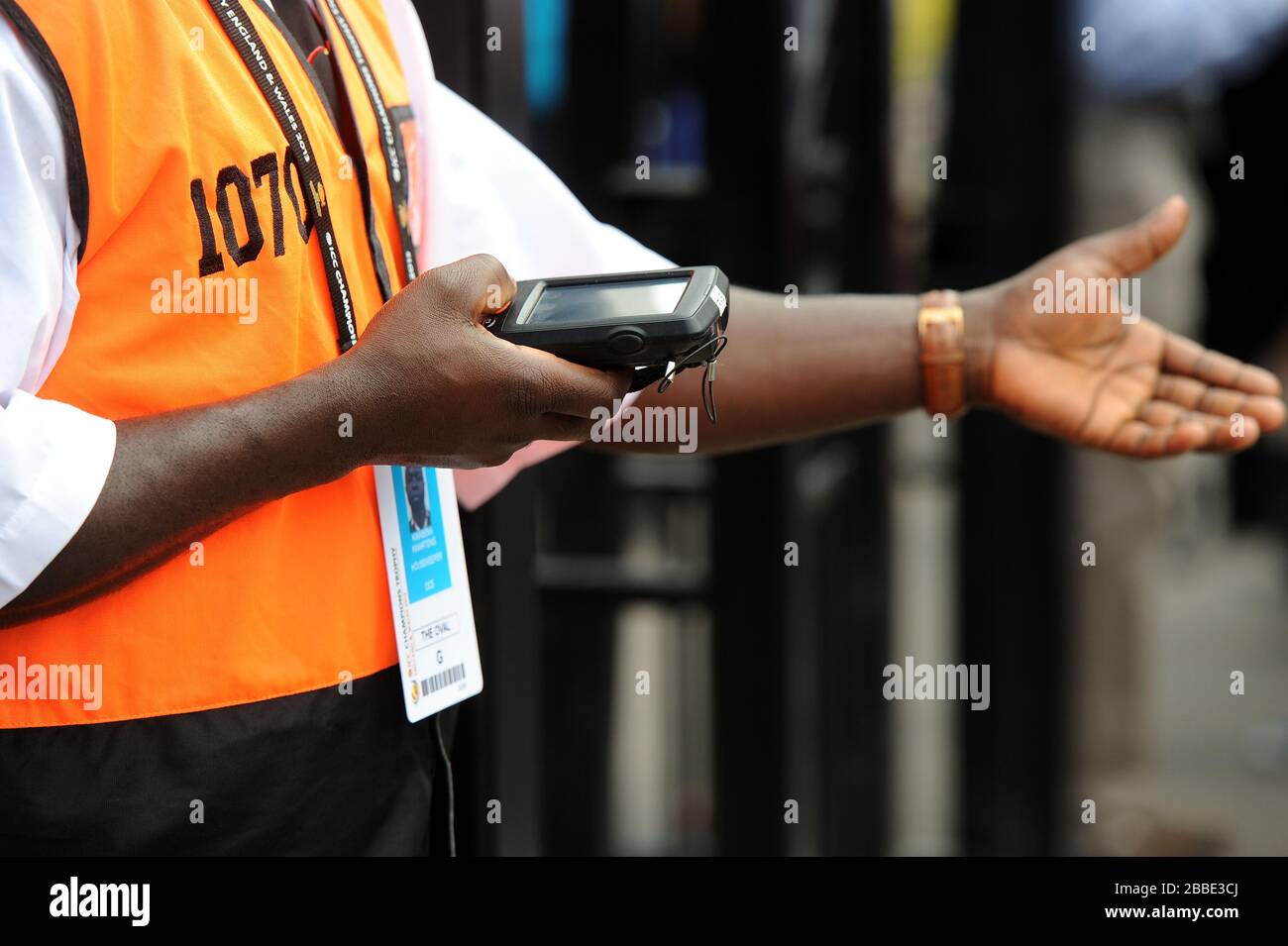 Stewards scan tickets as fans enter the Kia Oval Stock Photo - Alamy