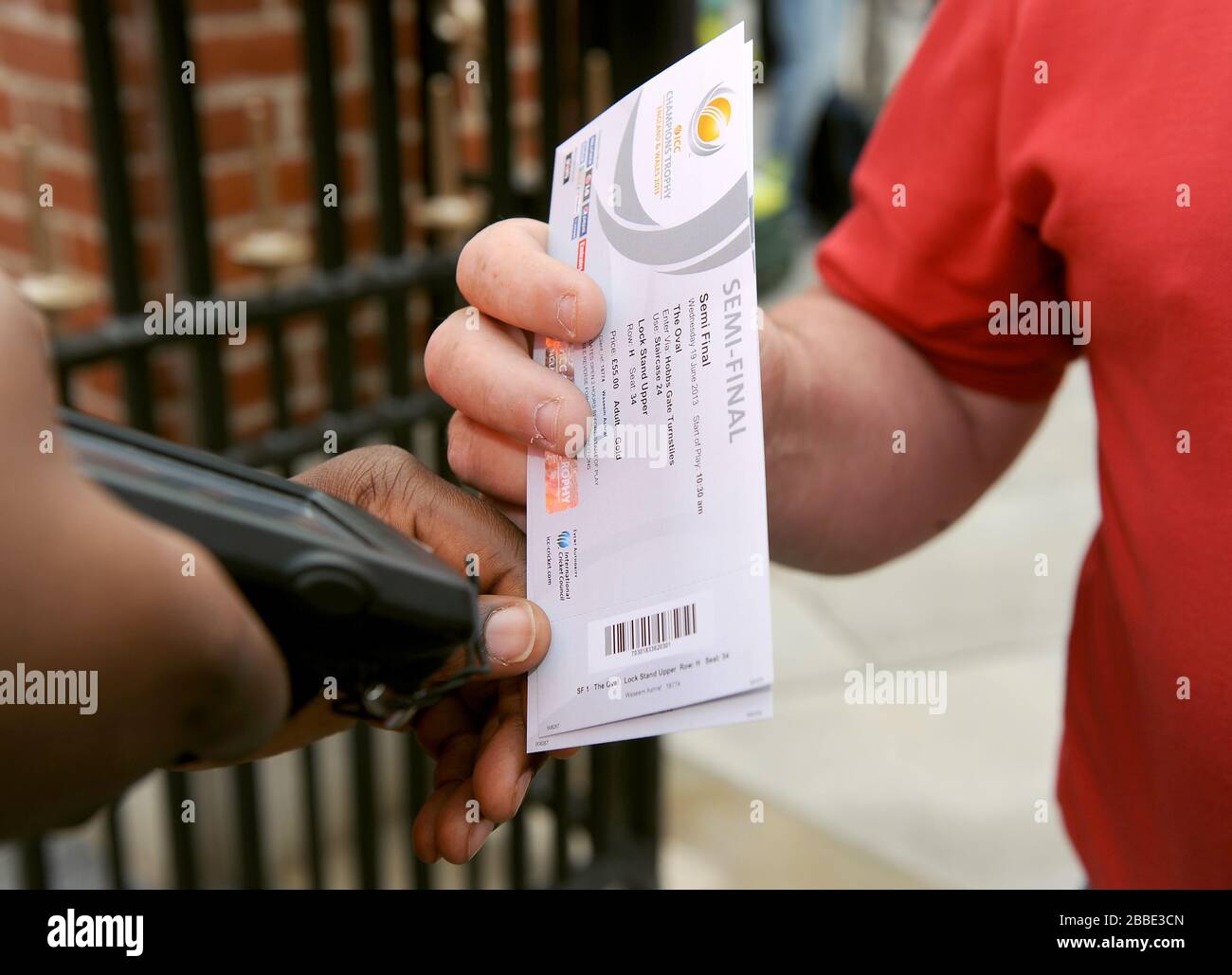 Stewards scan tickets as fans enter the Kia Oval Stock Photo - Alamy