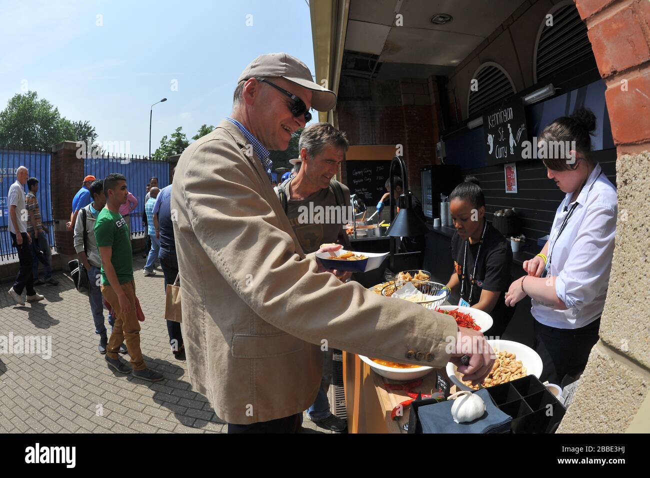 Fans at the Indian Wraps stand Stock Photo - Alamy