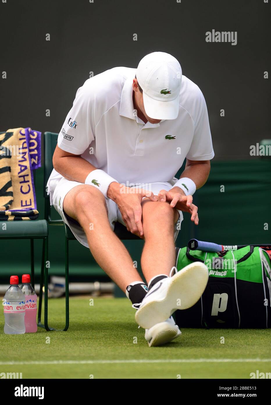 USA's John Isner struggles with an injury before retiring from his ...