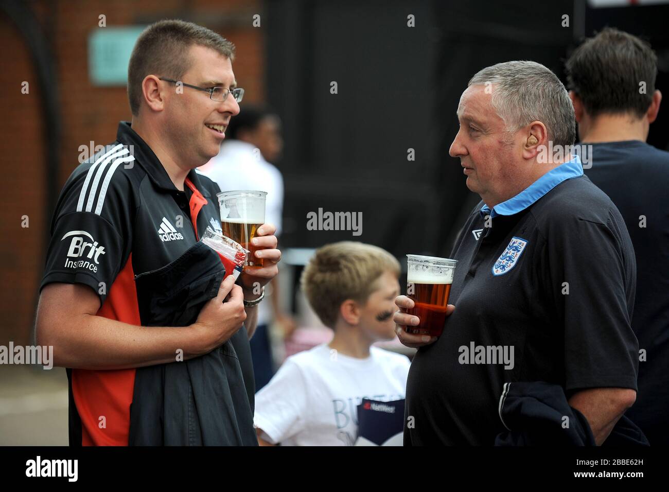 Spectators grab a drink inside the Kia Oval before the match Stock ...