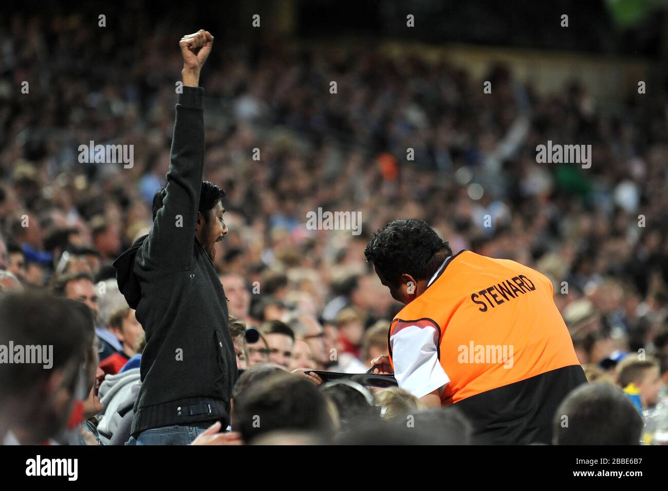 A steward signs a autograph for a fan Stock Photo - Alamy