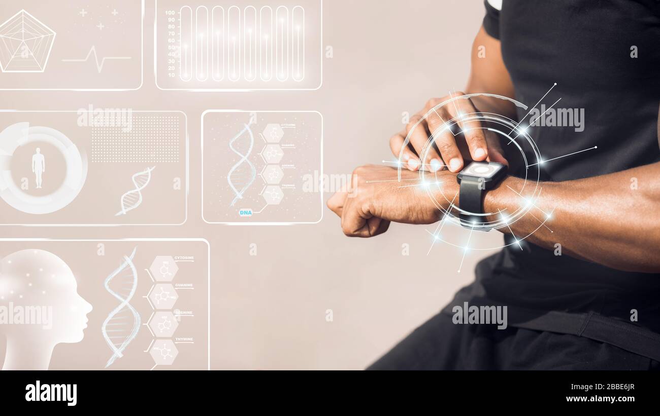 African American man using smartwatch fitness tracker on light ...