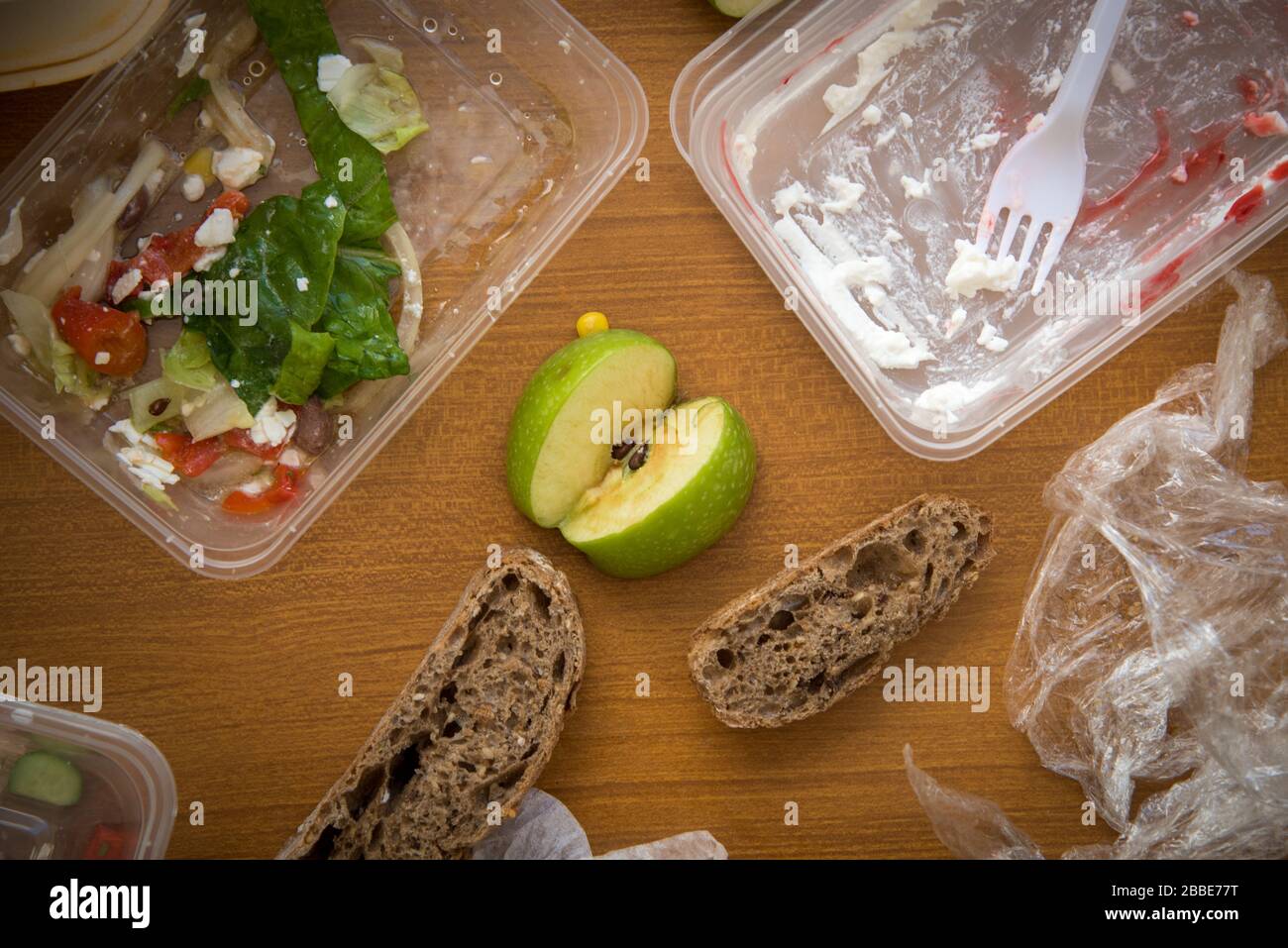 The remains of a food including salad, apple bread and dessert Stock ...