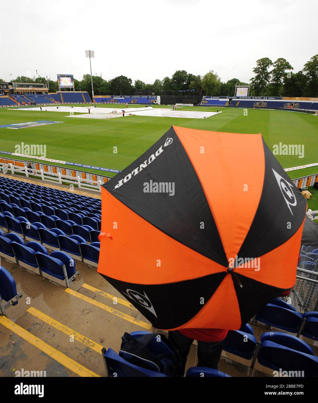 General view of rain covers on the pitch as the start of the ICC ...