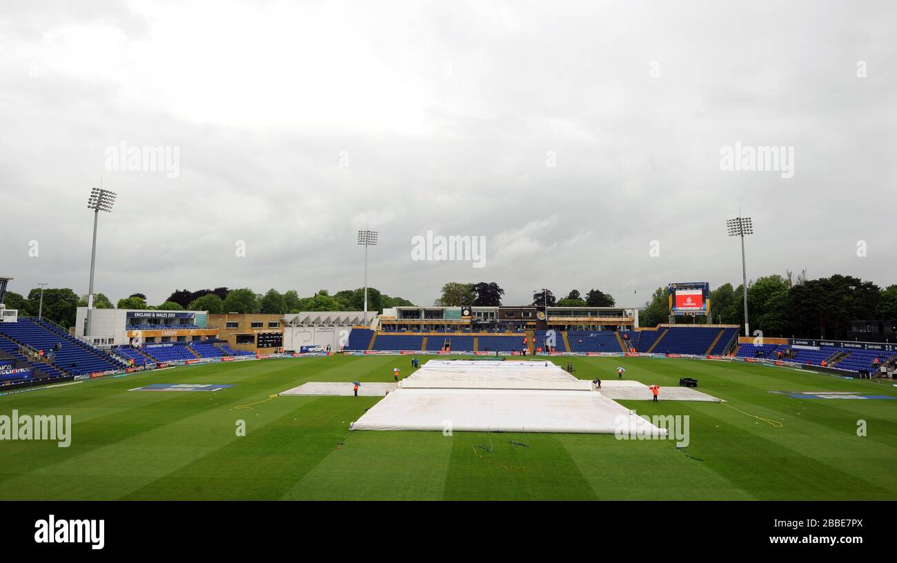 General view of rain covers on the pitch as the start of the ICC ...