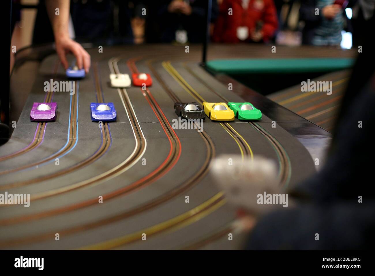 A scalextric activity inside at Sandown Park Racecourse Stock Photo - Alamy