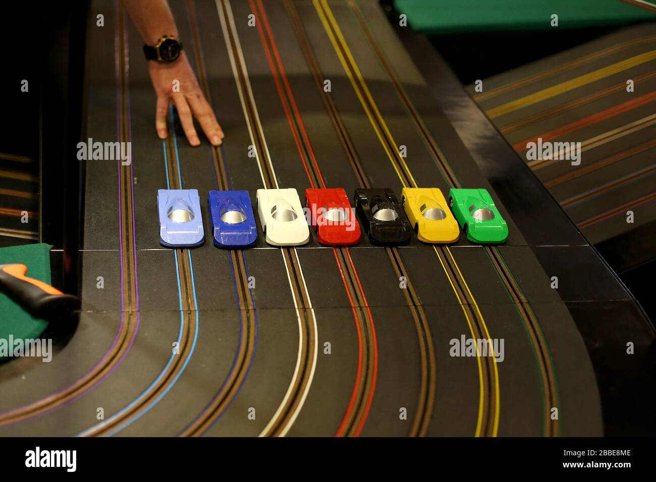 A scalextric activity inside at Sandown Park Racecourse Stock Photo - Alamy