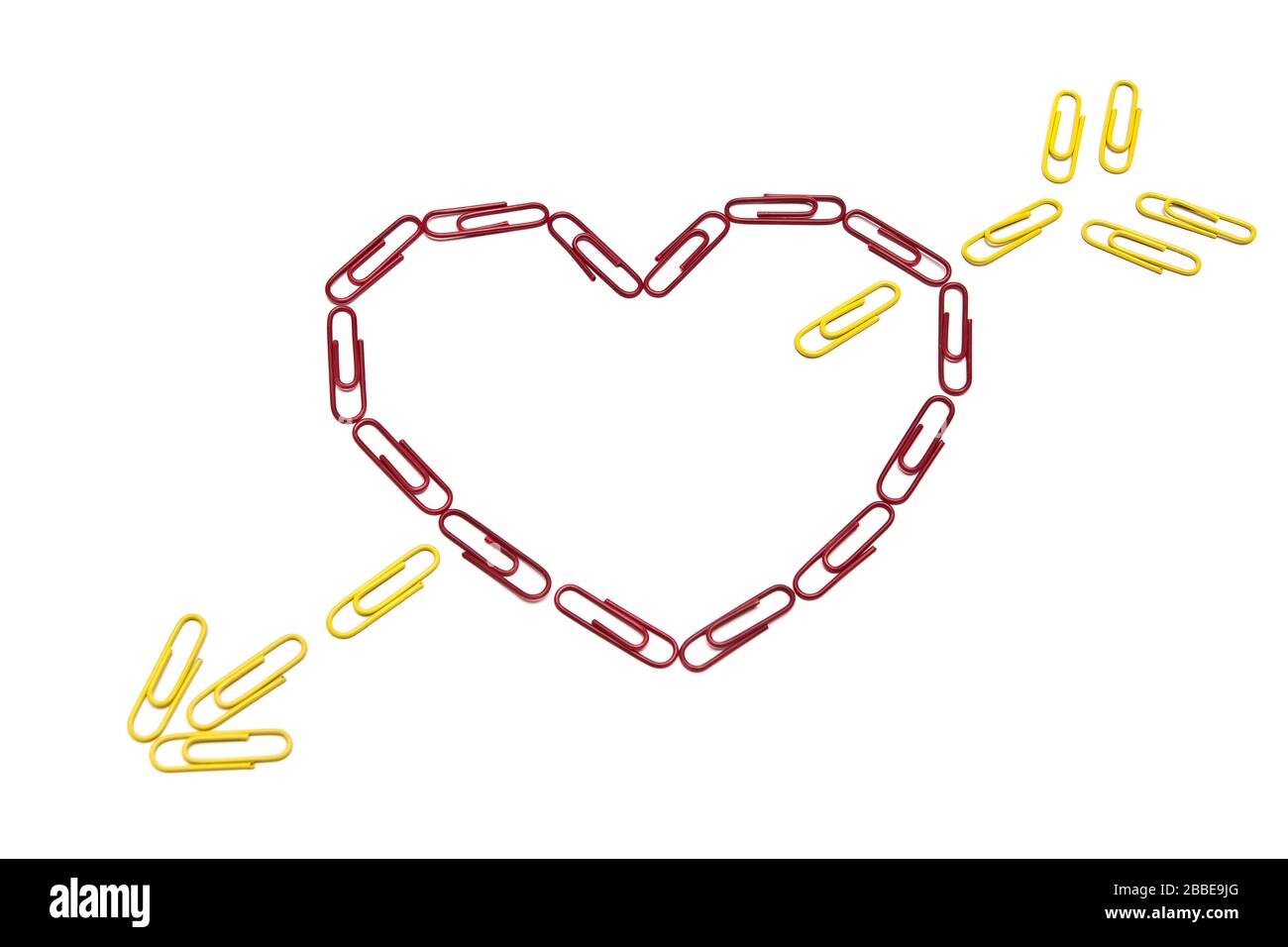 Paper clips heart on the isolated background Stock Photo - Alamy