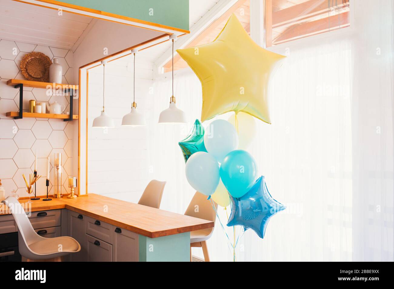 large Yellow foil balloon star in the kitchen in a residential ...