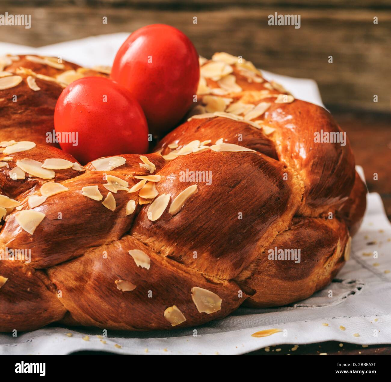 Easter traditional sweet bread, greek tsoureki and red eggs closeup ...