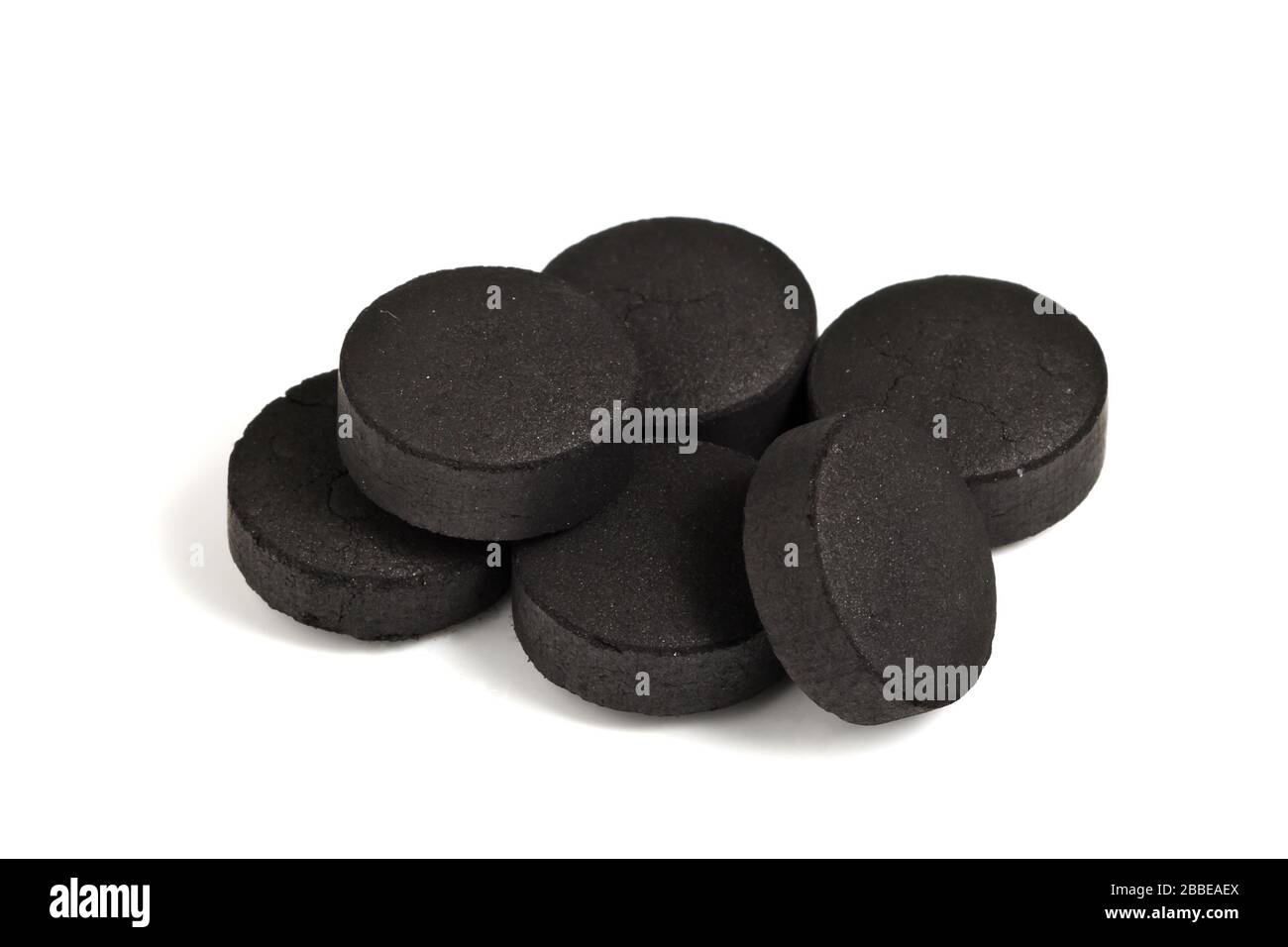 Activated coal on the isolated background Stock Photo - Alamy