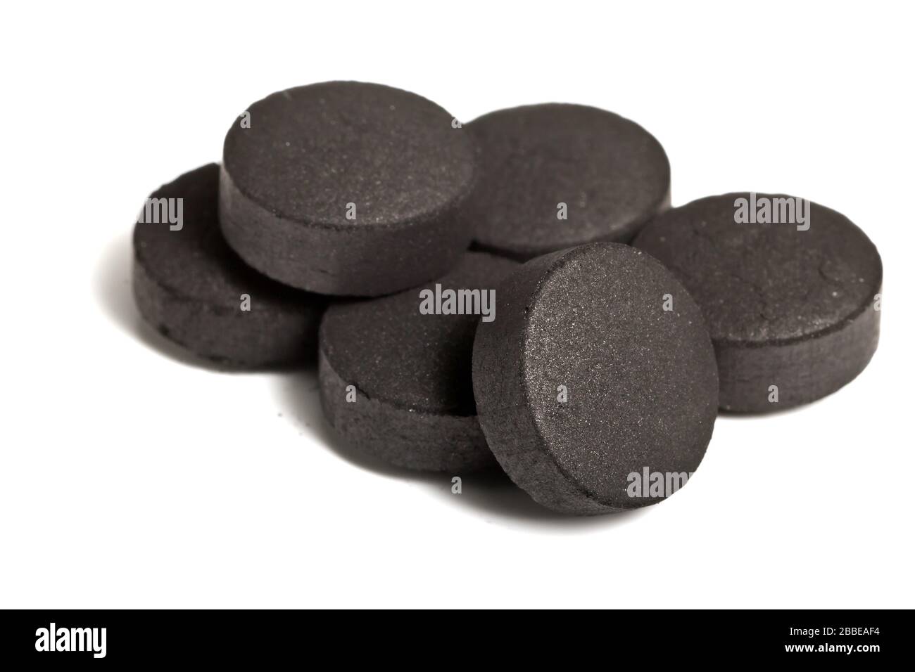 Activated coal on the isolated background Stock Photo - Alamy