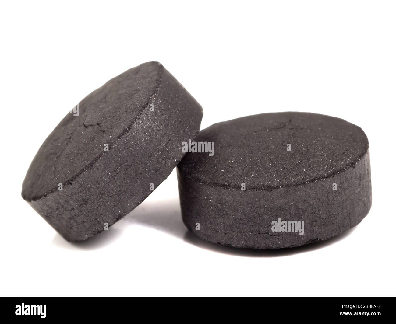 Activated coal on the isolated background Stock Photo - Alamy