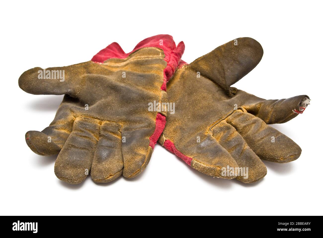 Old dirty leather gloves Cut Out Stock Images & Pictures - Alamy