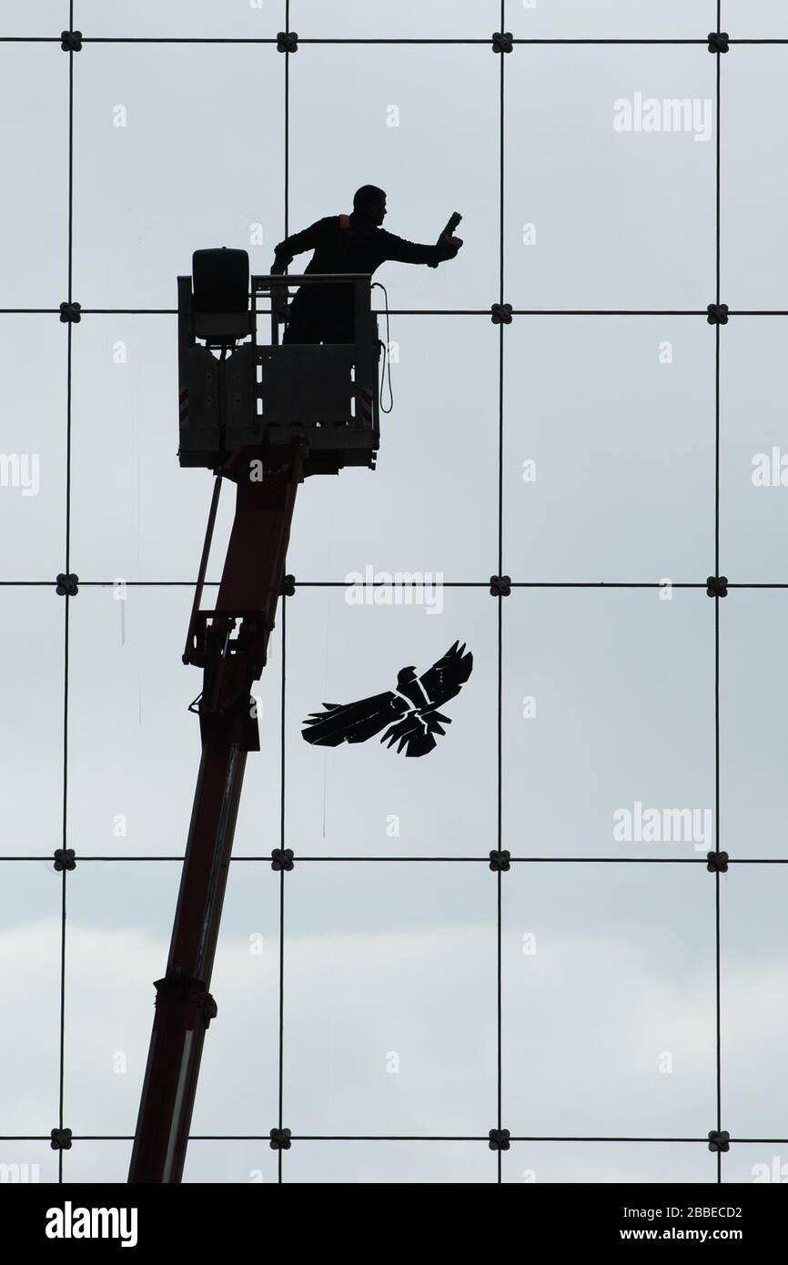 Dresden, Germany. 31st Mar, 2020. A building cleaner can be seen as a ...