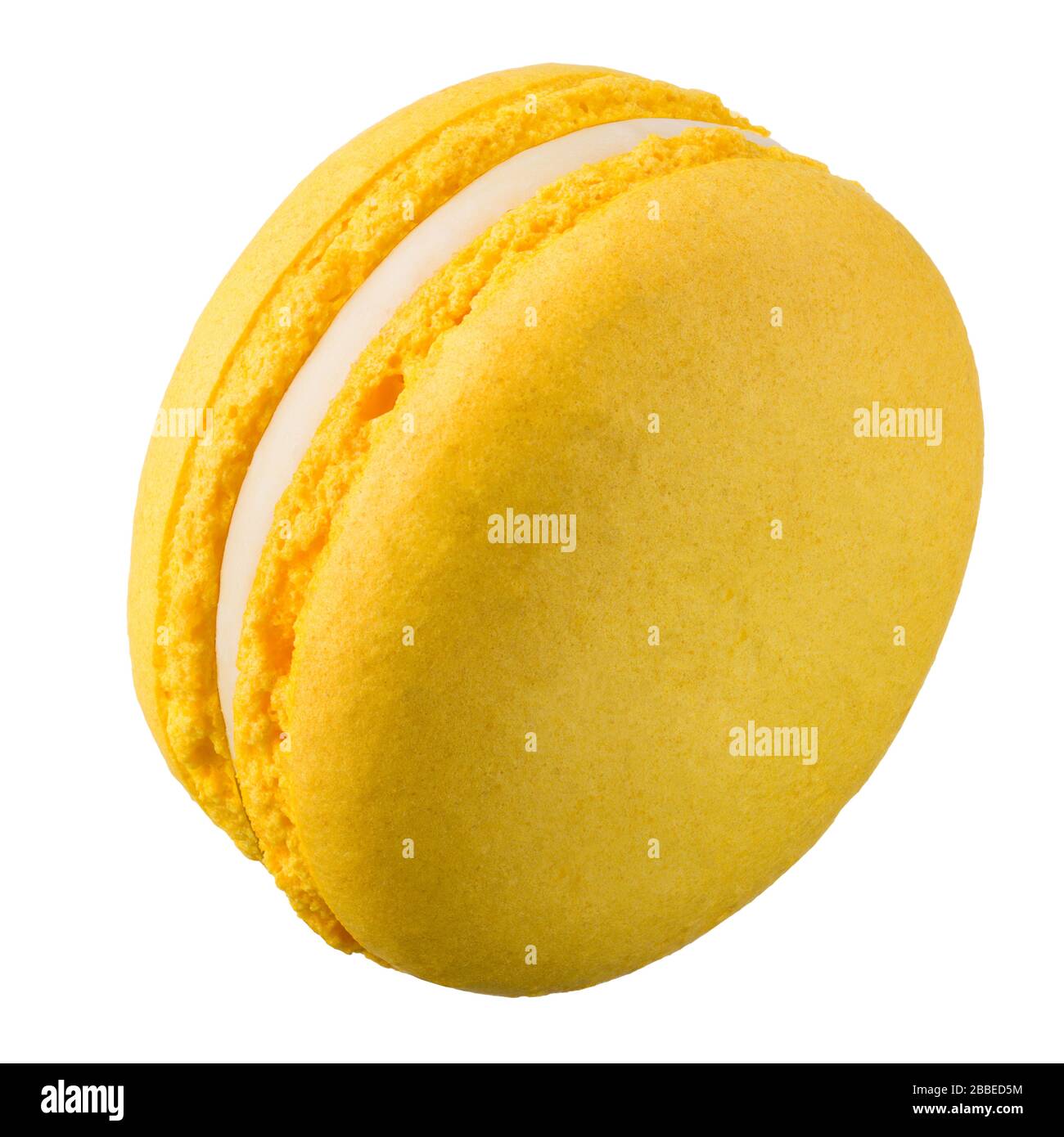 Macro photo of french yellow macaroon isolated on white background ...