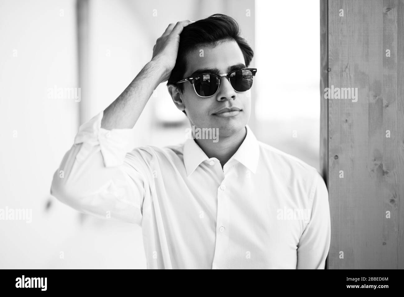 Cool young man posing for the camera Stock Photo - Alamy